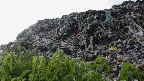 Huge garbage dump. Pile of waste dump in... | Stock Video | Pond5