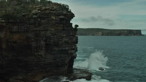 Huge splash from wave hitting cliffs at ... | Stock Video | Pond5