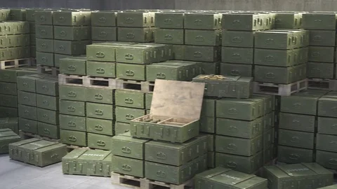 Huge stack of ammo boxes with RPG missil... | Stock Video | Pond5