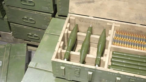 Huge stack of ammo boxes with RPG missil... | Stock Video | Pond5