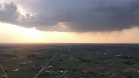 A huge storm cell passes over the fields... | Stock Video | Pond5