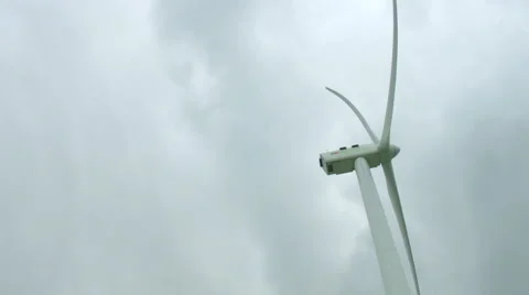 Huge wind turbine blades rotating under ... | Stock Video | Pond5
