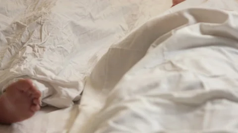 Human corpse covered with a sheet in roo... | Stock Video | Pond5