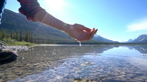 Human hand cupped to catch fresh water f... | Stock Video | Pond5