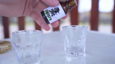 human hand drops some liquid from the li... | Stock Video | Pond5