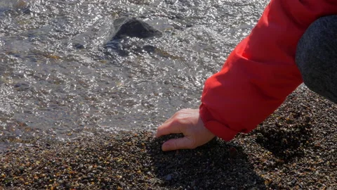 human hand, touching rocks and pebbles o... | Stock Video | Pond5