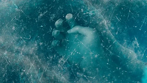A human hand under the ice. The dead bod... | Stock Video | Pond5