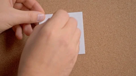 Human hands attach a sticker to the blac... | Stock Video | Pond5