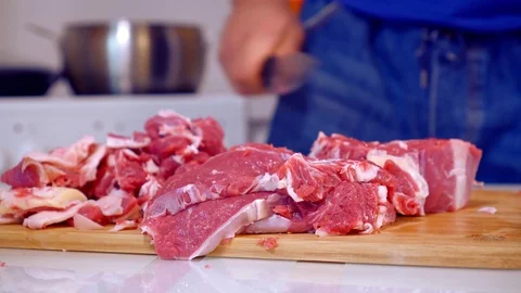 Human hands cut meat with a knife. Butch... | Stock Video | Pond5