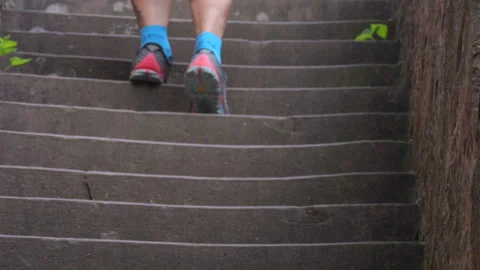 Human legs rise up on old trampled stone... | Stock Video | Pond5