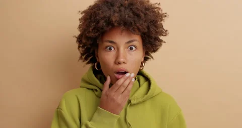 Human reaction concept. Surprised dark s... | Stock Video | Pond5