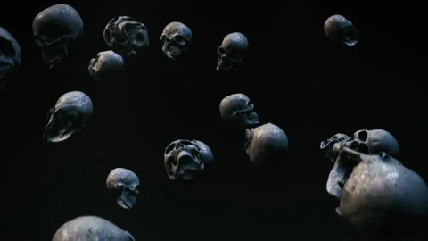 human skulls falling in front of dark ba... | Stock Video | Pond5
