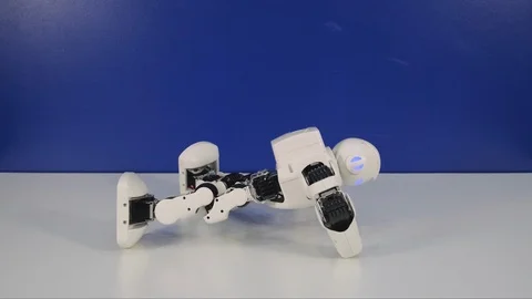 Humanoid robot doing push-ups on table | Stock Video | Pond5