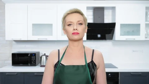 humor. woman in leather corset, puts on ... | Stock Video | Pond5