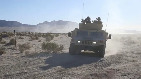 Humvee armored vehicles driving over san... | Stock Video | Pond5