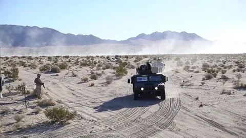 Humvee armored vehicles driving through ... | Stock Video | Pond5