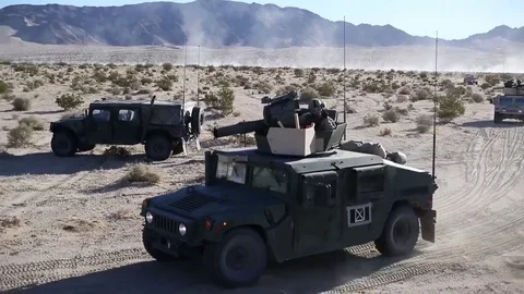 Humvee armored vehicles driving through ... | Stock Video | Pond5