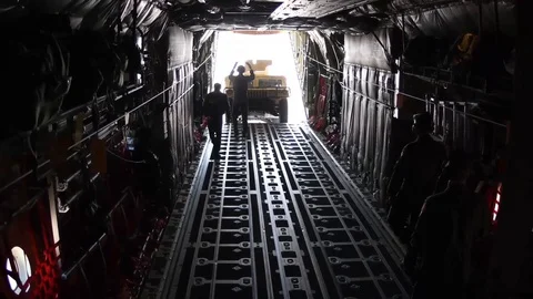 Humvee is being loaded in Lockheed Marti... | Stock Video | Pond5
