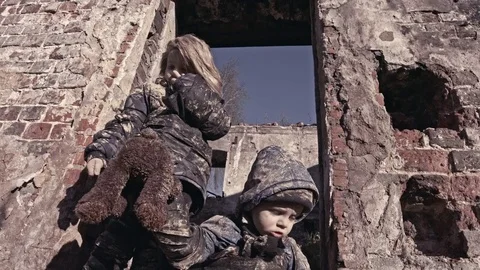 Hungry homeless children near the ruins.... | Stock Video | Pond5