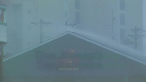 Hurricane winds blow rain over building ... | Stock Video | Pond5