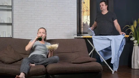 husband is angry at his wife watching TV... | Stock Video | Pond5