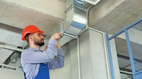 Hvac worker install ducted pipe system f... | Stock Video | Pond5