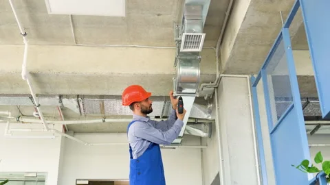 Hvac worker install ducted pipe system f... | Stock Video | Pond5