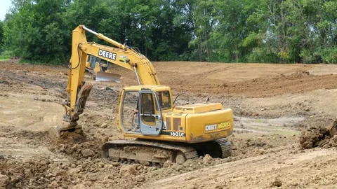 Hydraulic excavator removing dirt from b... | Stock Video | Pond5