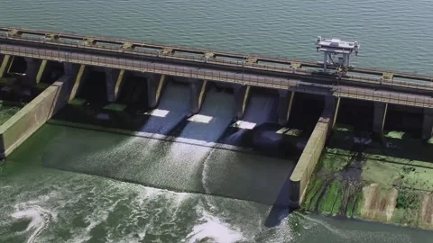 Hydroelectric dam with flowing water thr... | Stock Video | Pond5