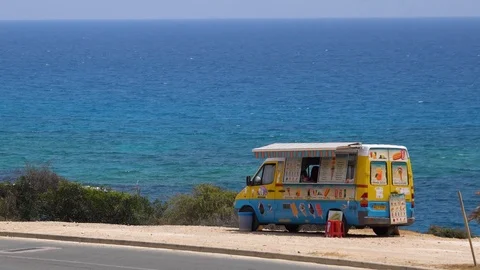Ice cream bus on the beach. Color bus wi... | Stock Video | Pond5