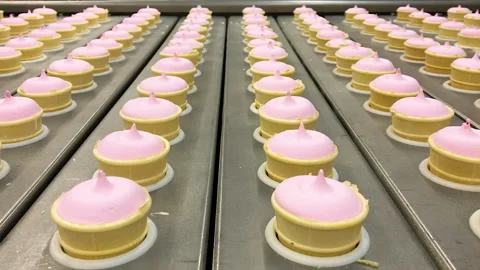 Ice cream factory. Lots of ice cream on ... | Stock Video | Pond5