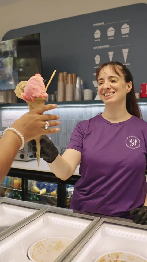 Ice cream parlor worker serving gelato c... | Stock Video | Pond5
