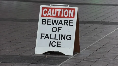 Ice falling hazard warning signs near ta... | Stock Video | Pond5