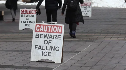 Ice falling hazard warning signs near ta... | Stock Video | Pond5
