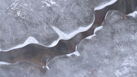 Ice forms on river at spring with water ... | Stock Video | Pond5