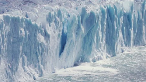 Ice from glacier falling off into the la... | Stock Video | Pond5