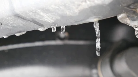 Ice melting from the edge of a car | Stock Video | Pond5
