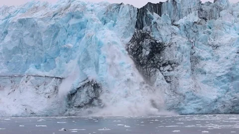 Ice melts and falls high from the glacie... | Stock Video | Pond5
