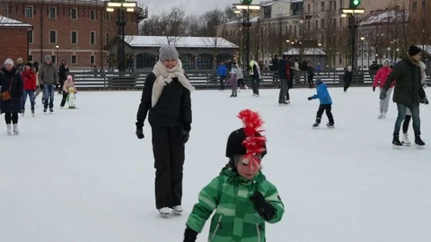 Ice skating rink, a crowd of people skat... | Stock Video | Pond5