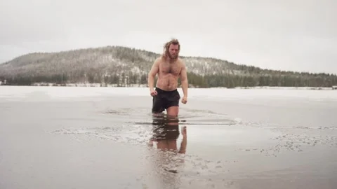 Ice Swimming - Man Waks Out Of Freezing ... | Stock Video | Pond5