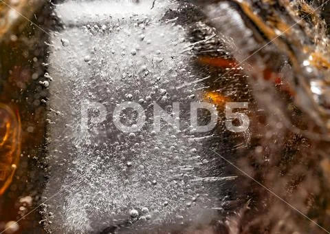 Ice Texture Details. Big Ice Cube in a Drink. Stock Photo #108012165