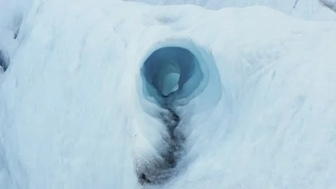 Ice tunnel created by water erosion insi... | Stock Video | Pond5