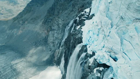 Icebergs falling in the water while a Gl... | Stock Video | Pond5