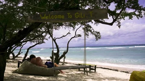 Iconic welcome to Gili T sign with swing... | Stock Video | Pond5