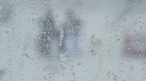 An icy window with children playing as b... | Stock Video | Pond5