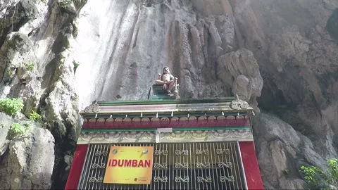 Idumban statue at limestone cliff wall i... | Stock Video | Pond5
