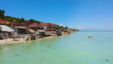 Idyllic ocean scenery by beach with trad... | Stock Video | Pond5