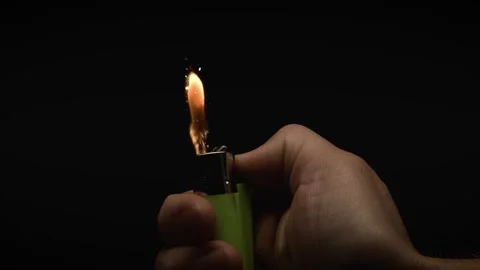 igniting a lighter in super slow motion.... | Stock Video | Pond5