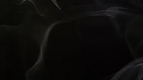 illuminated puffs of white smoke rise up... | Stock Video | Pond5