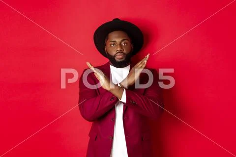 Image of serious Black man strongly disagree, showing cross sign to ...